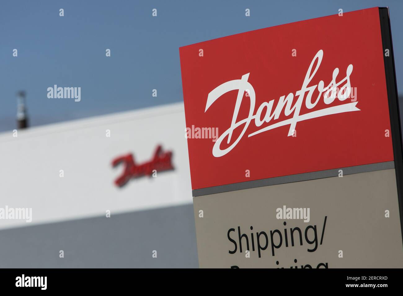 A logo sign outside of a facility occupied by The Danfoss Group in ...