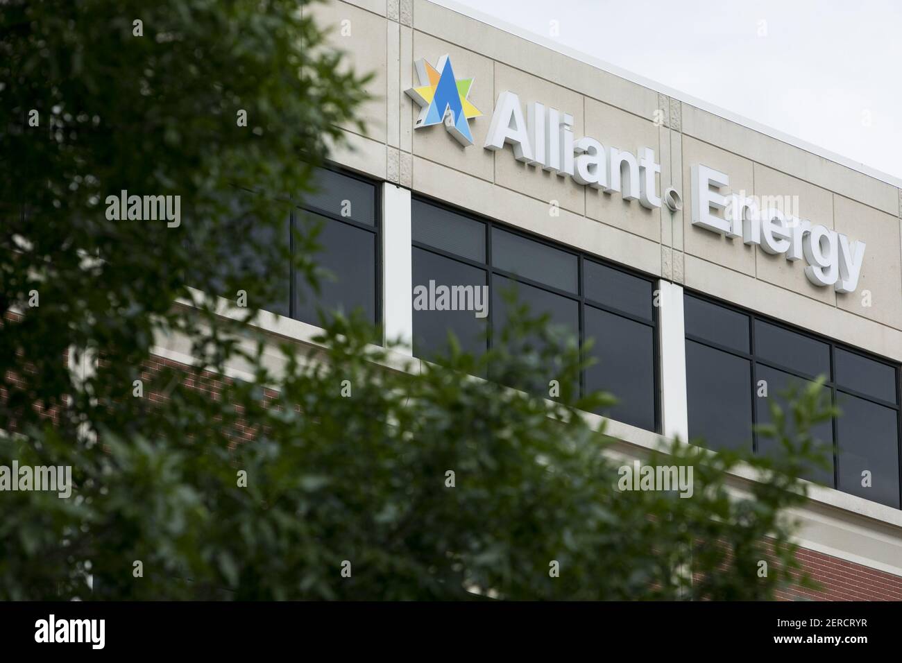 A logo sign outside of the headquarters of Alliant Energy in Madison ...