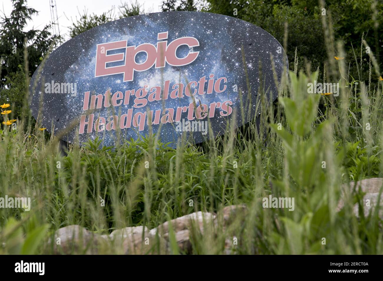 A logo sign outside of the headquarters of the Epic Systems Corporation ...