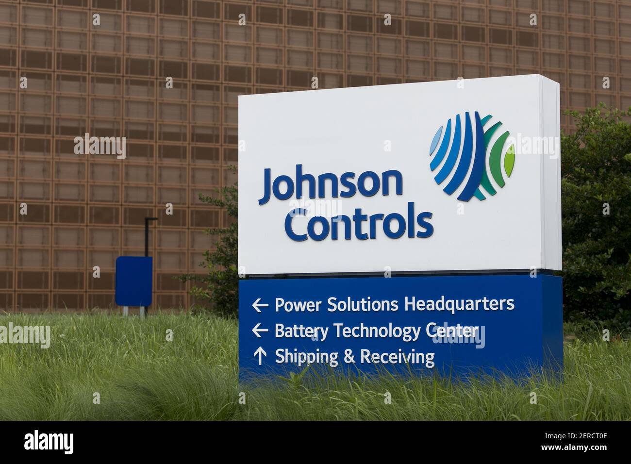 A logo sign outside of the headquarters of Johnson Controls in ...