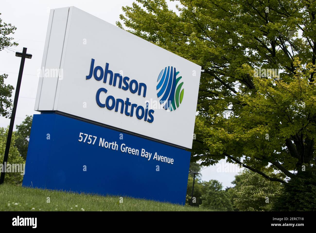 A logo sign outside of the headquarters of Johnson Controls in ...