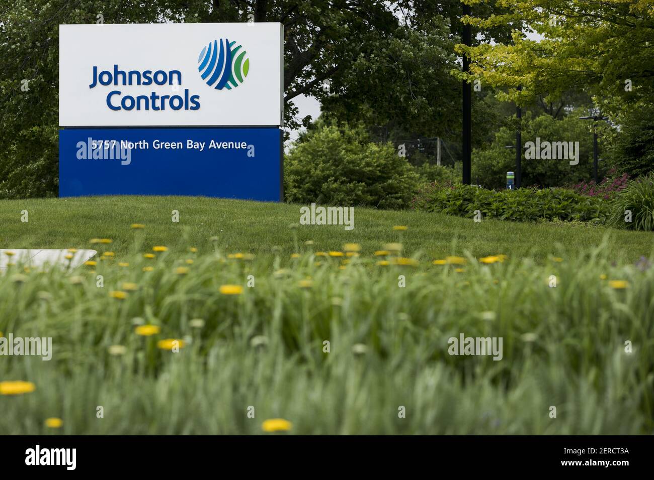 A logo sign outside of the headquarters of Johnson Controls in ...