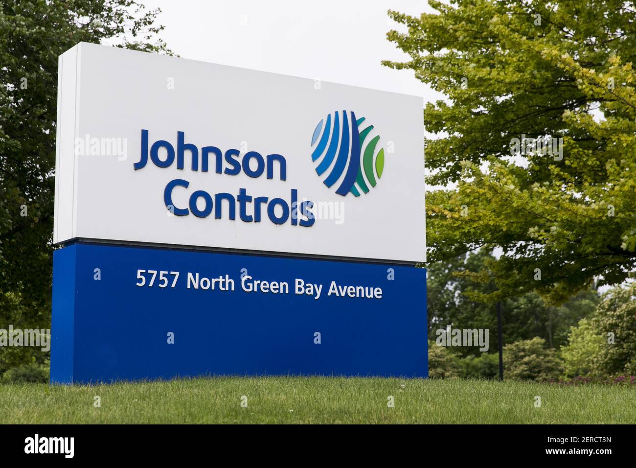 A logo sign outside of the headquarters of Johnson Controls in ...