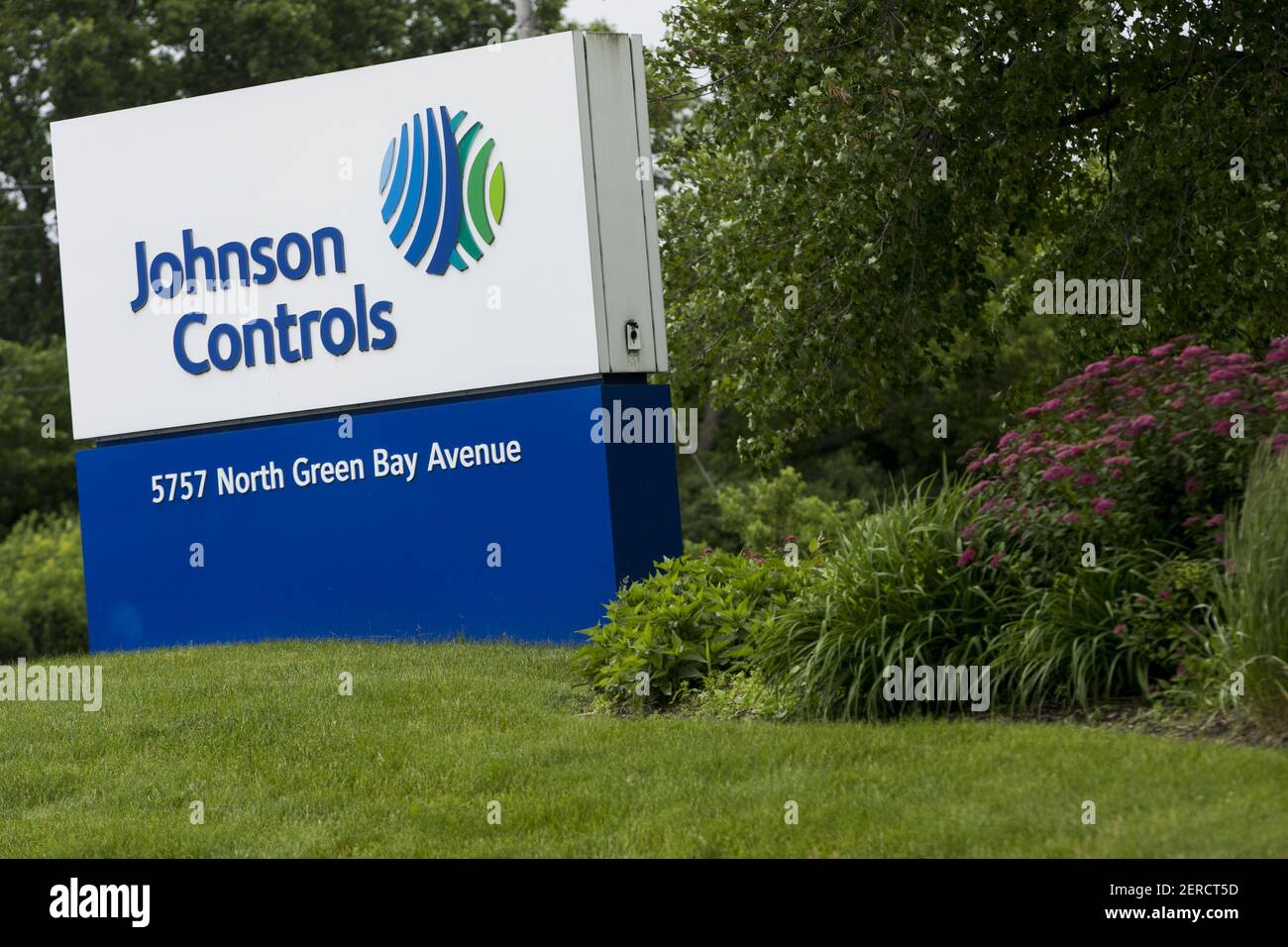 A logo sign outside of the headquarters of Johnson Controls in ...