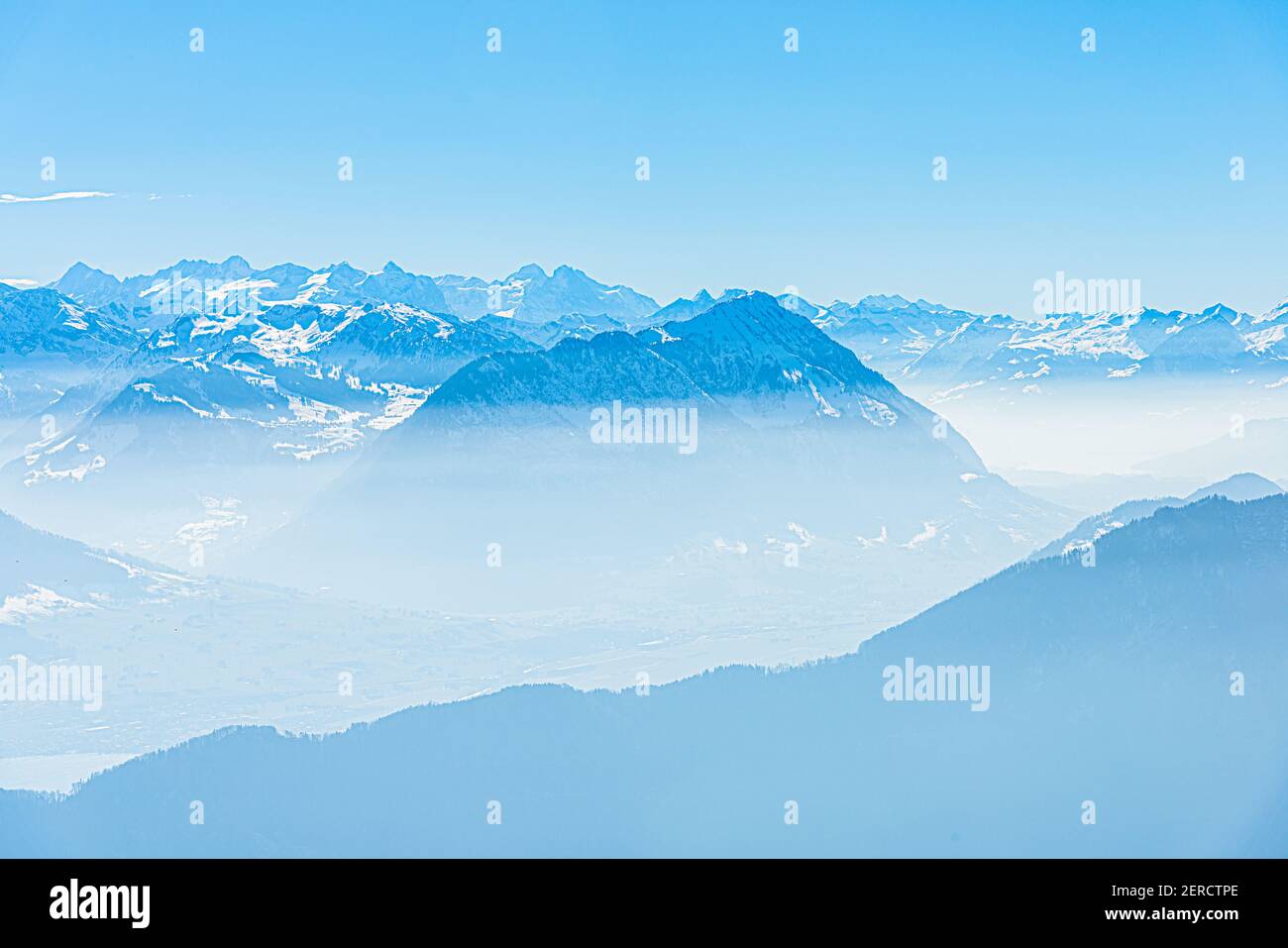 Unique panoramic alpine skyline aerial landscape view of misty iced ...