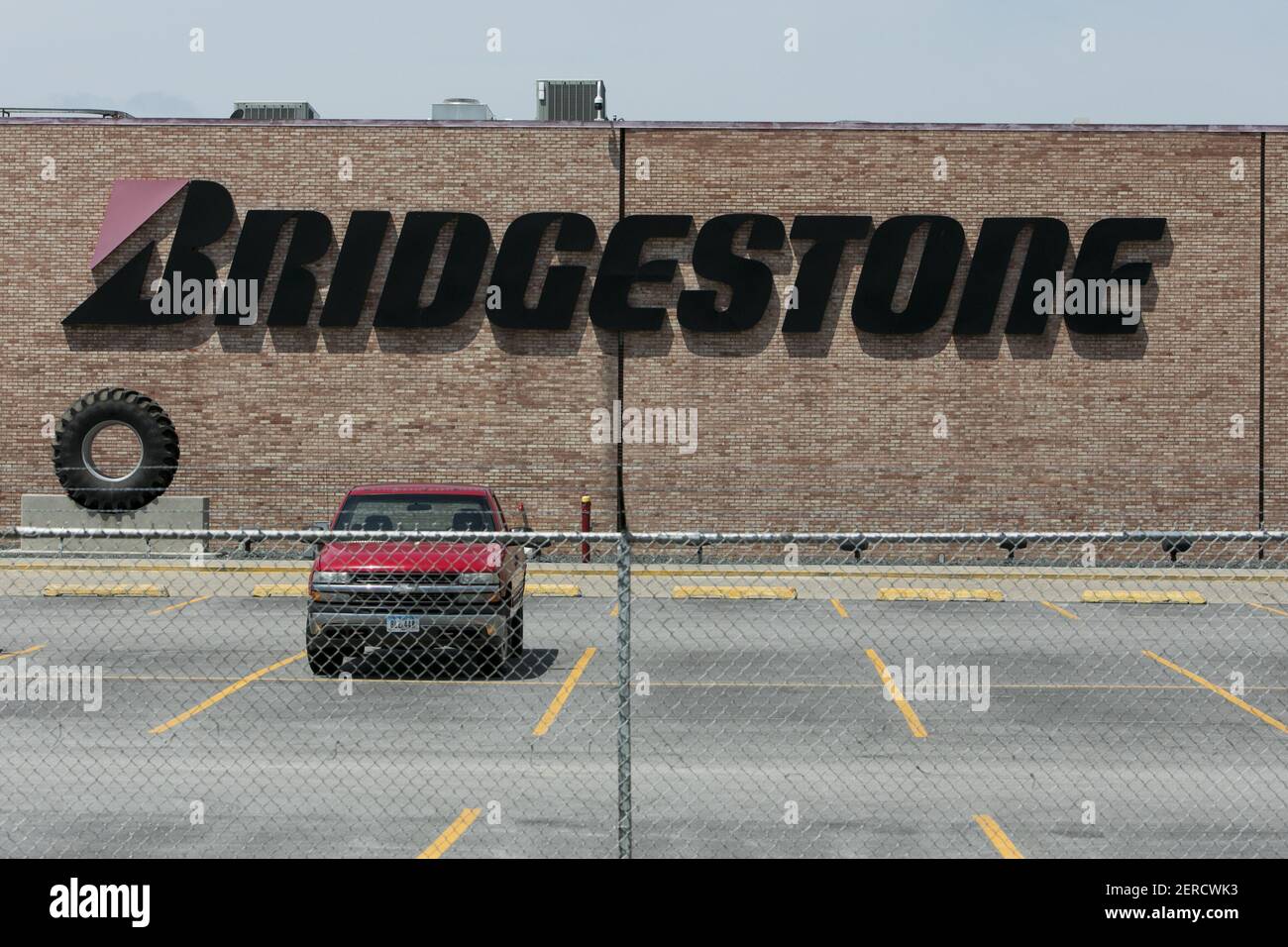 A logo sign outside of the Bridgestone Firestone agricultural tire ...