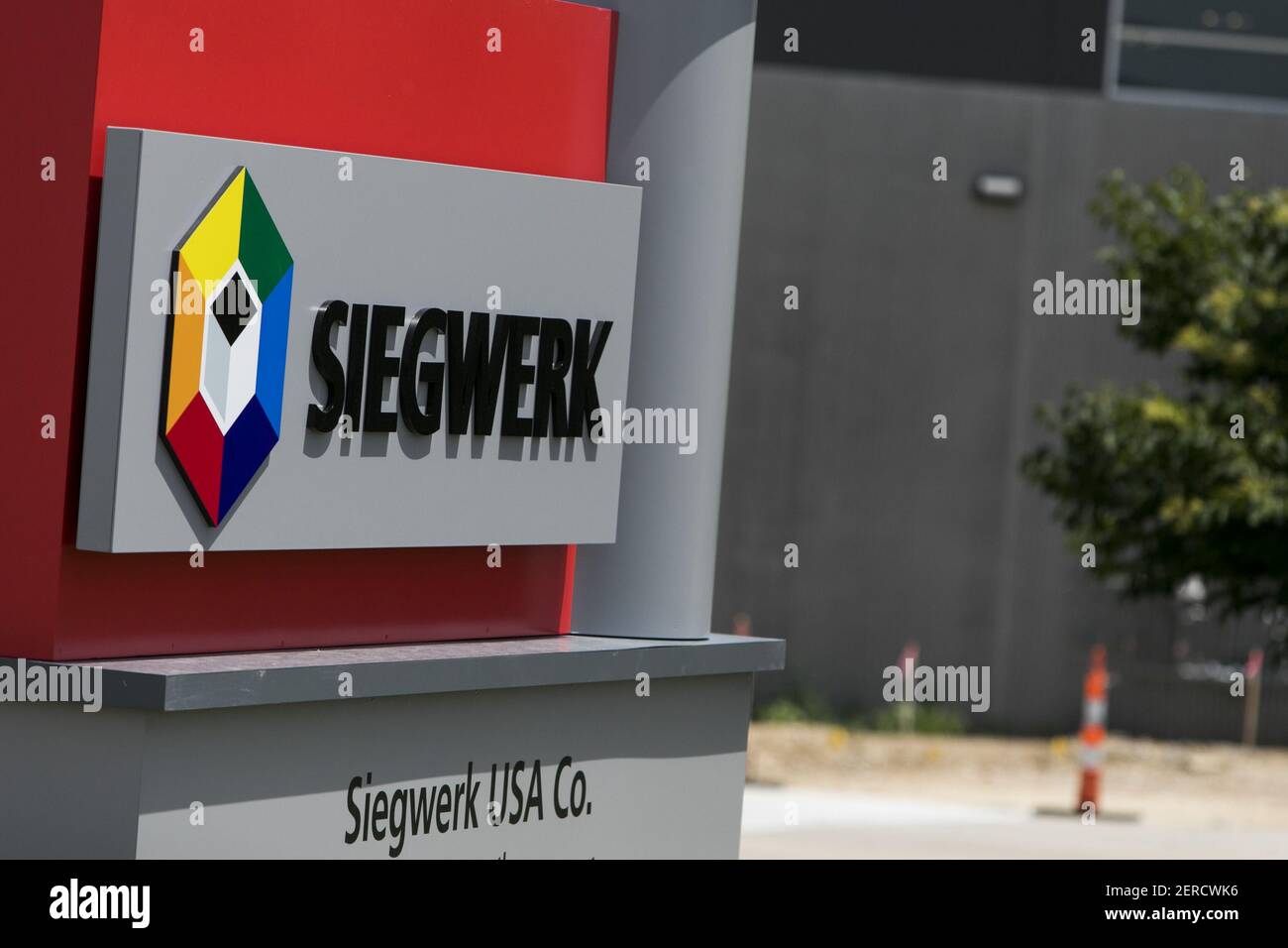 A logo sign outside of a facility occupied by Siegwerk in Des Moines ...