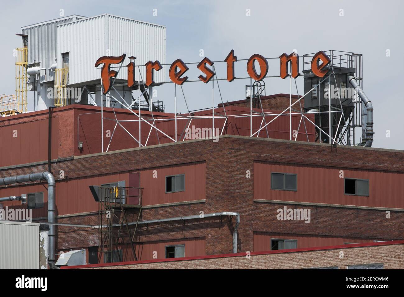 A logo sign outside of the Bridgestone Firestone agricultural tire ...