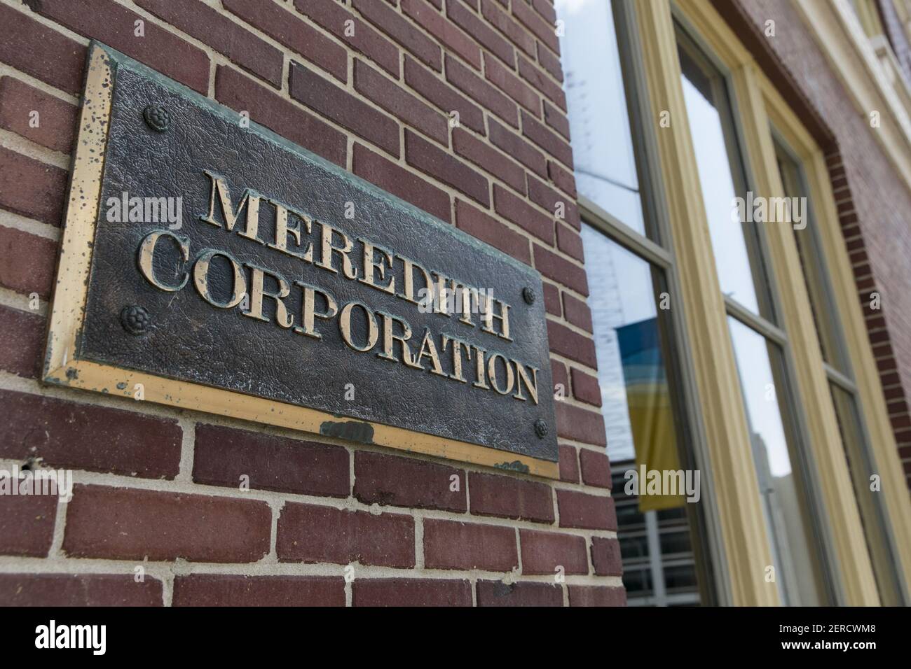 A logo sign outside of the headquarters of the Meredith Corporation in ...
