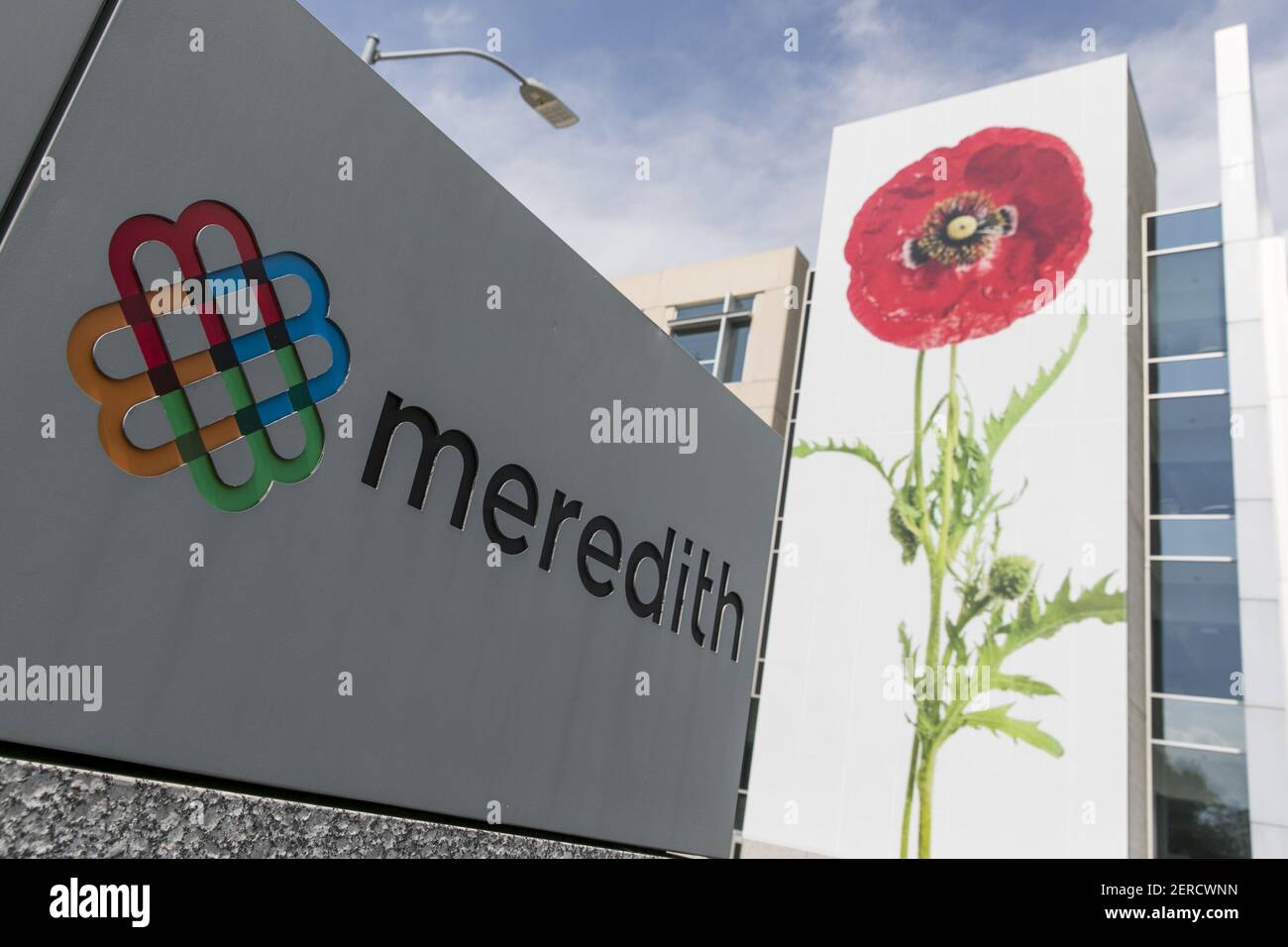 A logo sign outside of the headquarters of the Meredith Corporation in ...