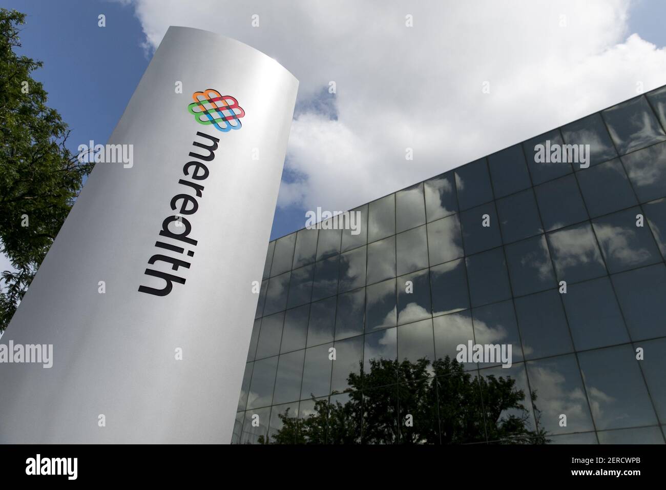 A logo sign outside of the headquarters of the Meredith Corporation in ...