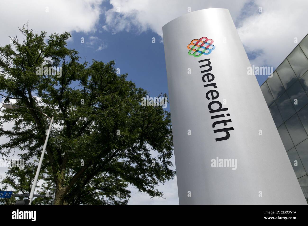 A logo sign outside of the headquarters of the Meredith Corporation in ...