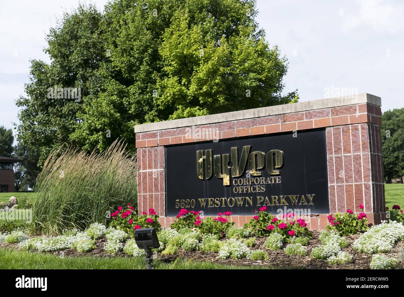 A logo sign outside of the headquarters of Hy-Vee, Inc., in West Des ...