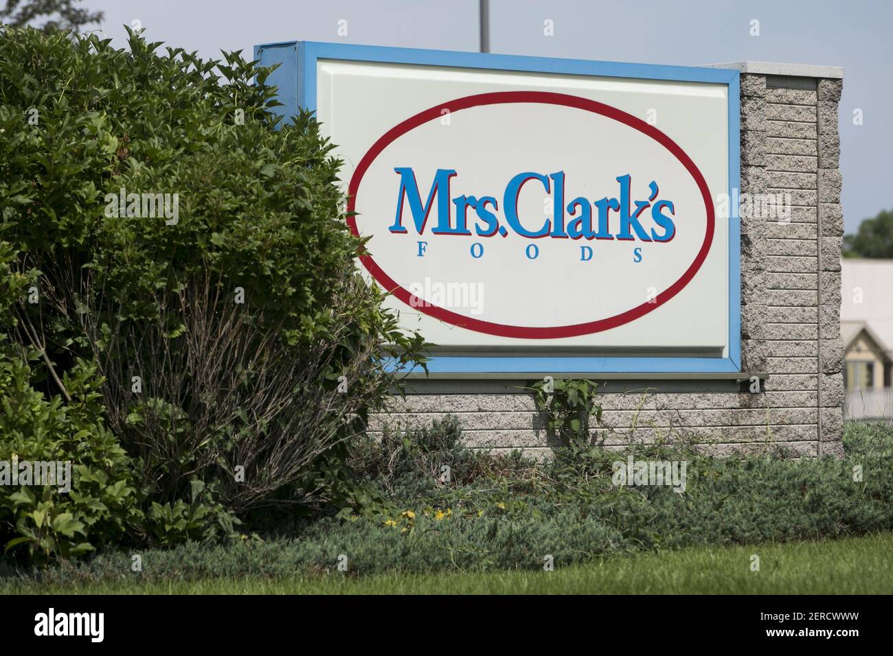 A logo sign outside of a facility occupied by Mrs. Clark's Foods in ...