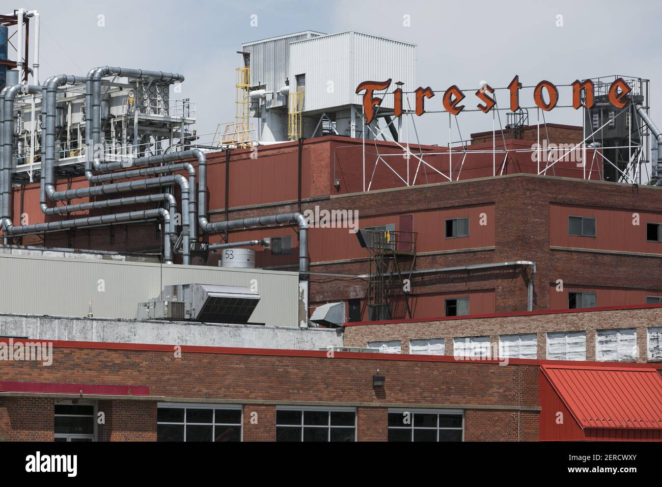 A logo sign outside of the Bridgestone Firestone agricultural tire ...