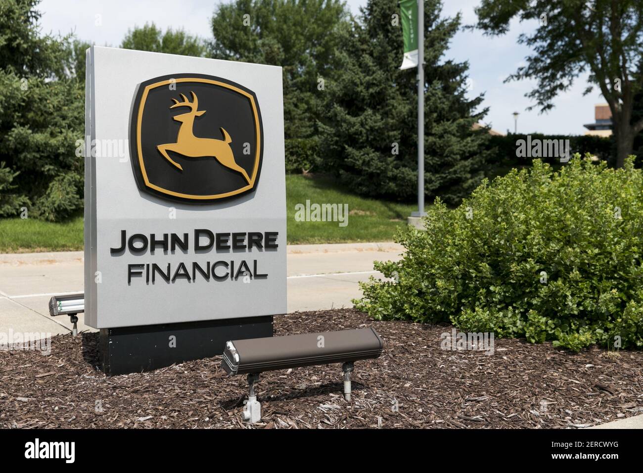 A logo sign outside of a facility occupied by John Deere Financial in ...