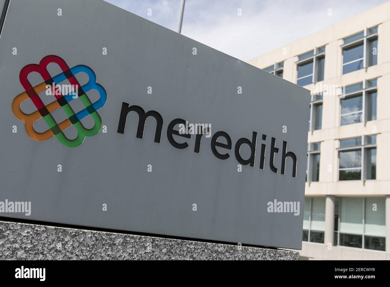 A logo sign outside of the headquarters of the Meredith Corporation in ...