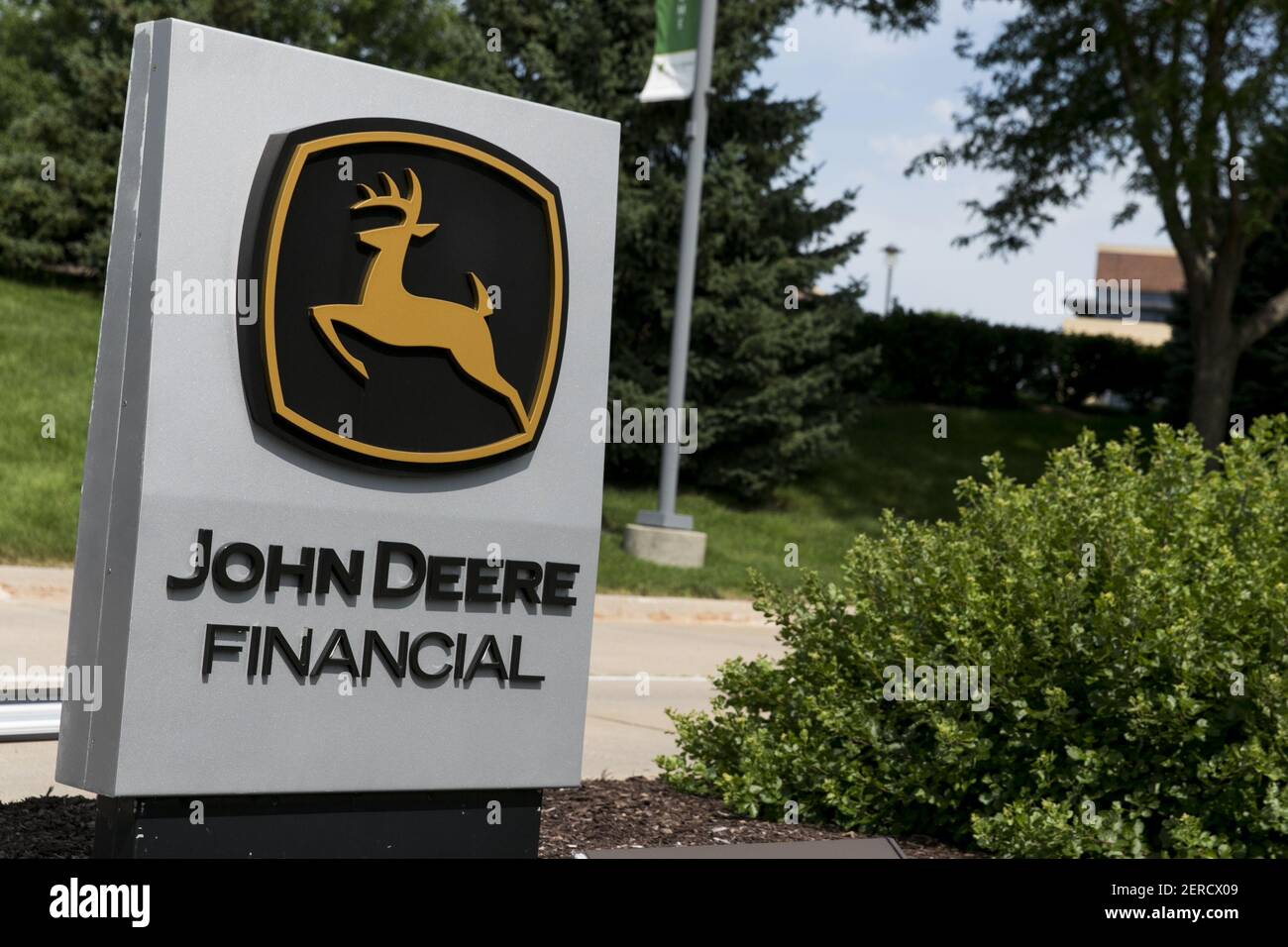 A logo sign outside of a facility occupied by John Deere Financial in ...