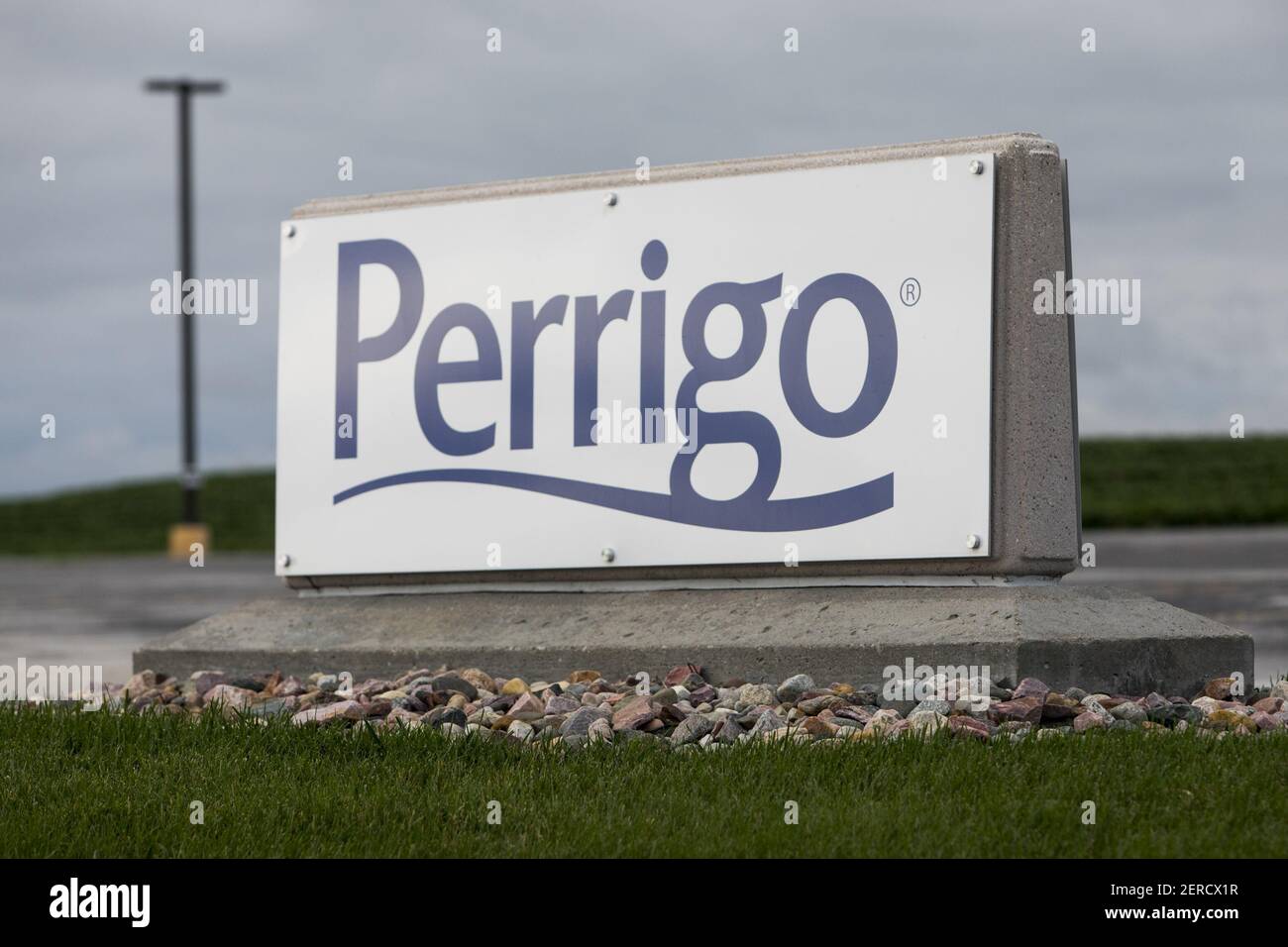 A logo sign outside of a facility occupied by the Perrigo Company in ...