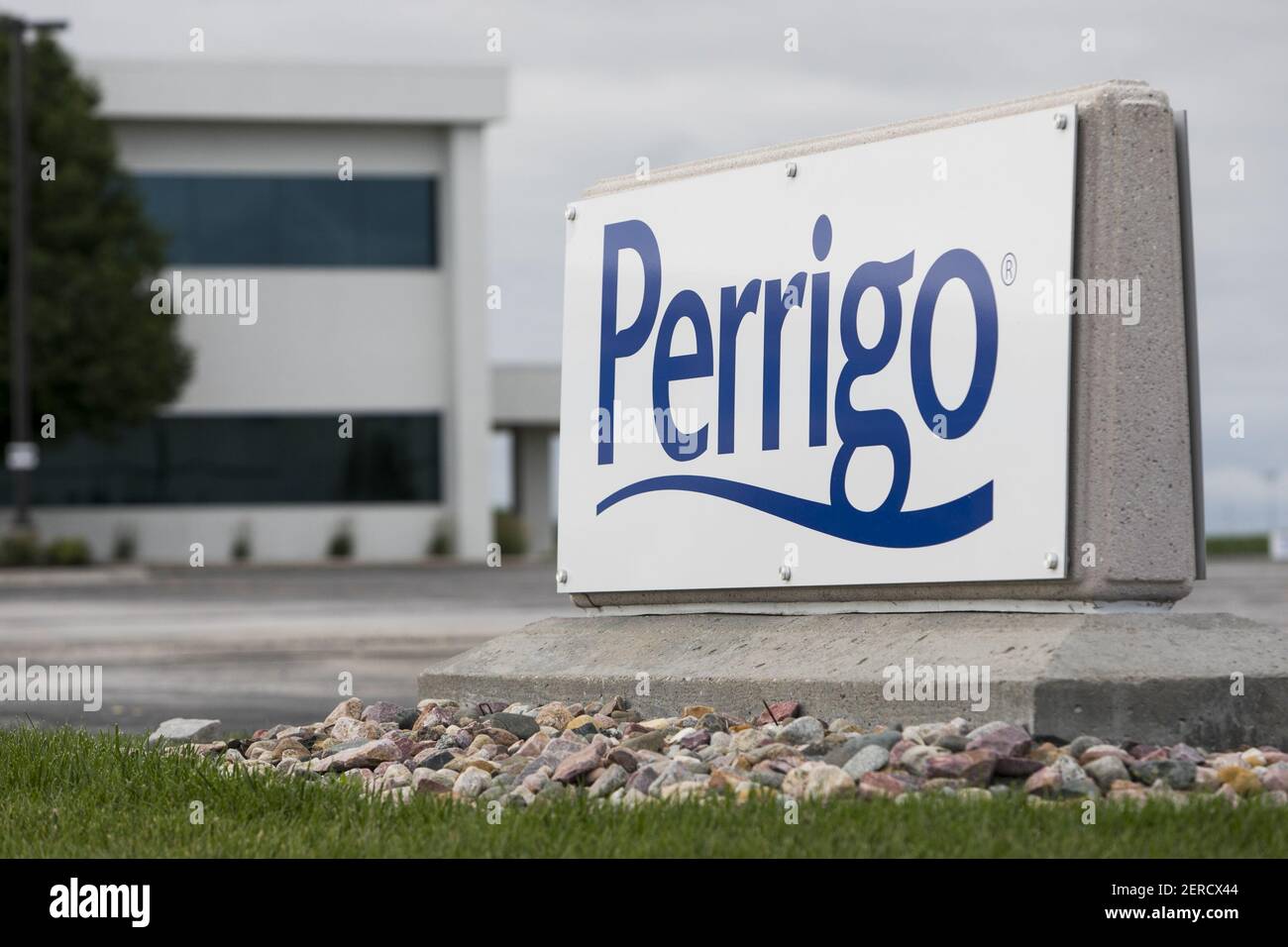 A logo sign outside of a facility occupied by the Perrigo Company in ...