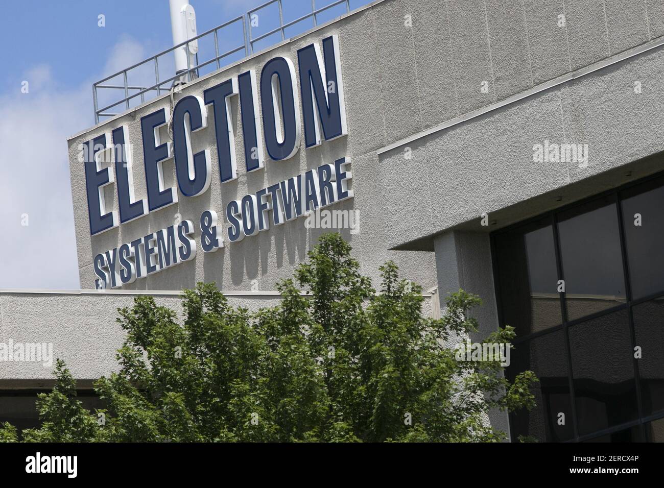 A logo sign outside of the headquarters of Election Systems & Software in Omaha, Nebraska on ...