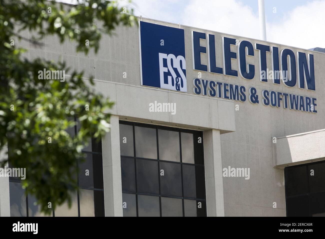 A logo sign outside of the headquarters of Election Systems & Software ...