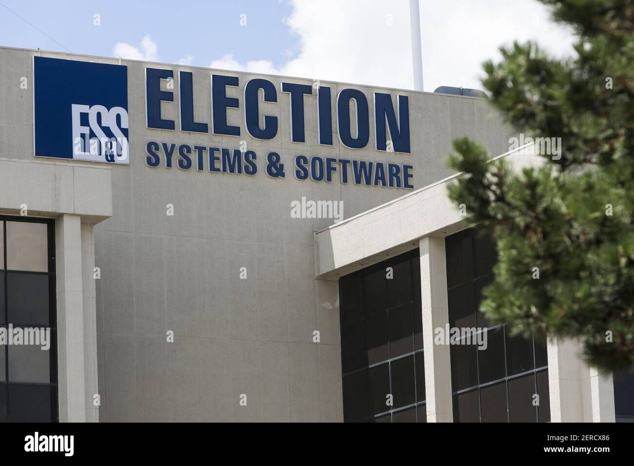 A logo sign outside of the headquarters of Election Systems & Software ...