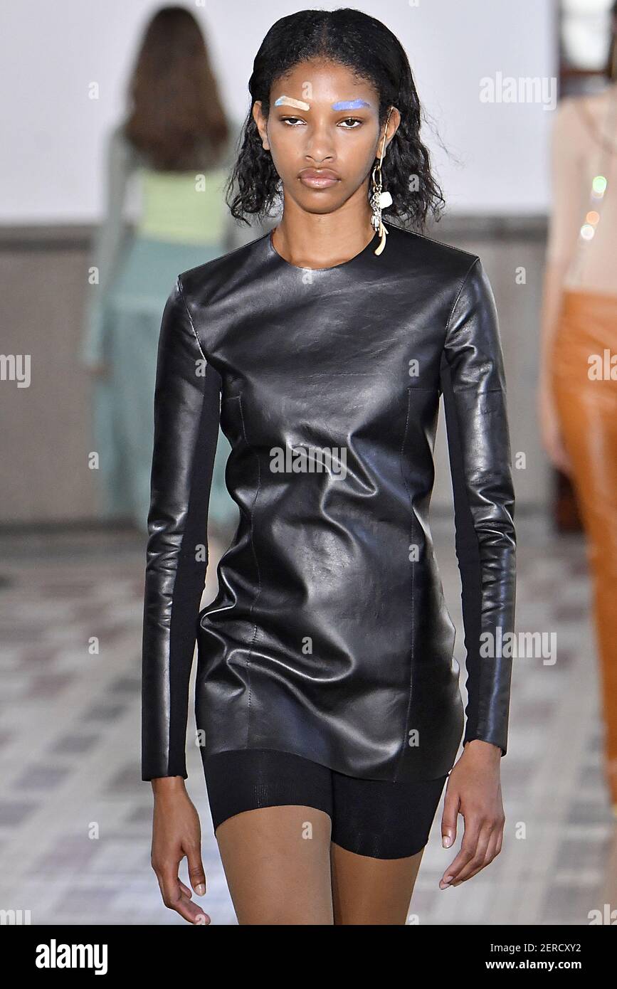Naomi Chin Wing walks on the runway during the Acne Studios Paris ...