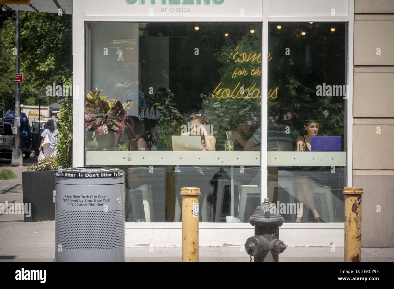 Customers on their laptops in a coffee cafe in Chelsea in New York on ...