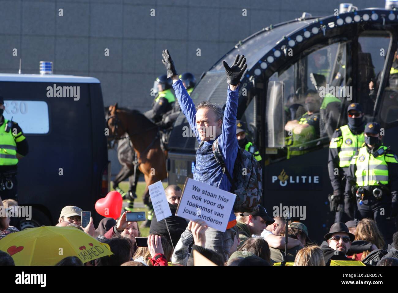 Dutch anti-riot police enclose anti-lockdown supporters during illegal ...