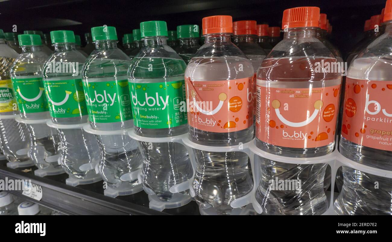 Bottles of Pepsi's new Bubly brand carbonated flavored water drink in a convenience store cooler ...