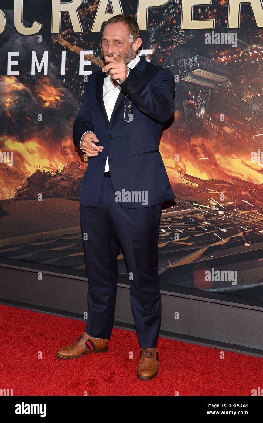 Actor Roland Moller attends the "Skyscraper" Premiere at the AMC Loews ...