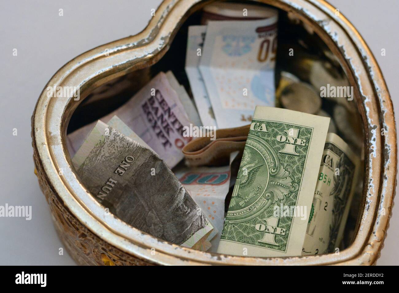 a donation box with a heart shape, collecting money for charity ...
