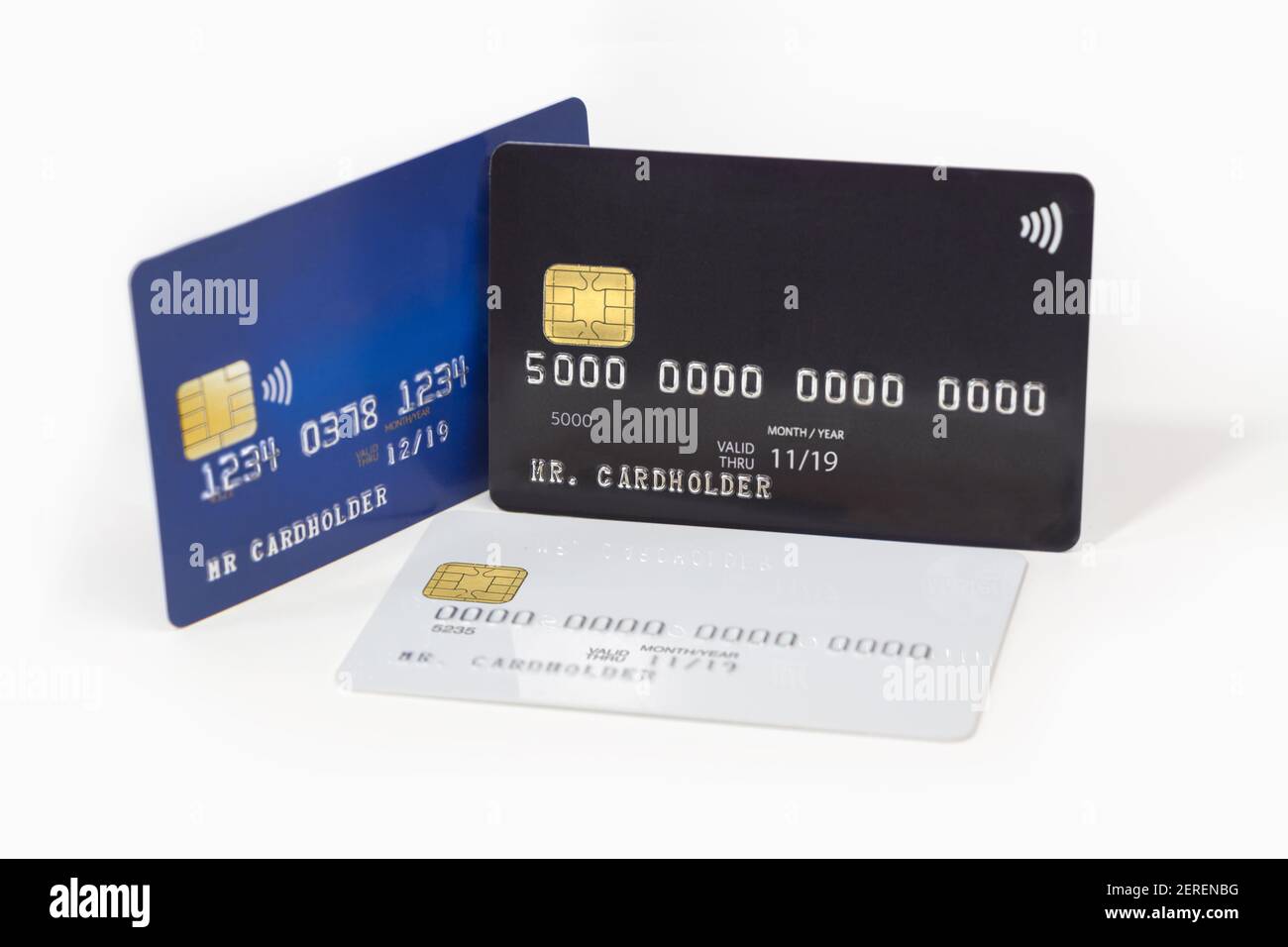 Blue, white and black credit cards on white background Stock Photo - Alamy