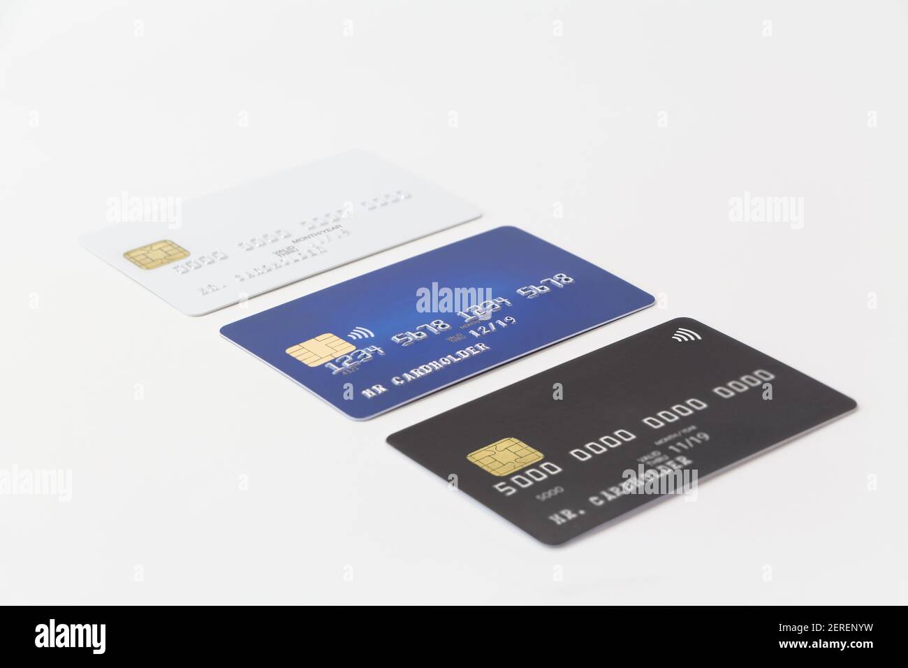 Three credit cards in the row on white background Stock Photo - Alamy