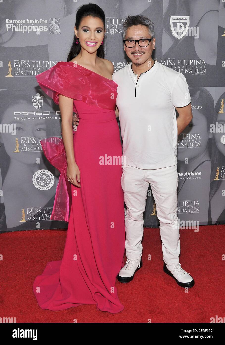 (L-R) Model Jamie Herrell and Fashion Designer Alan Del Rosario at the ...
