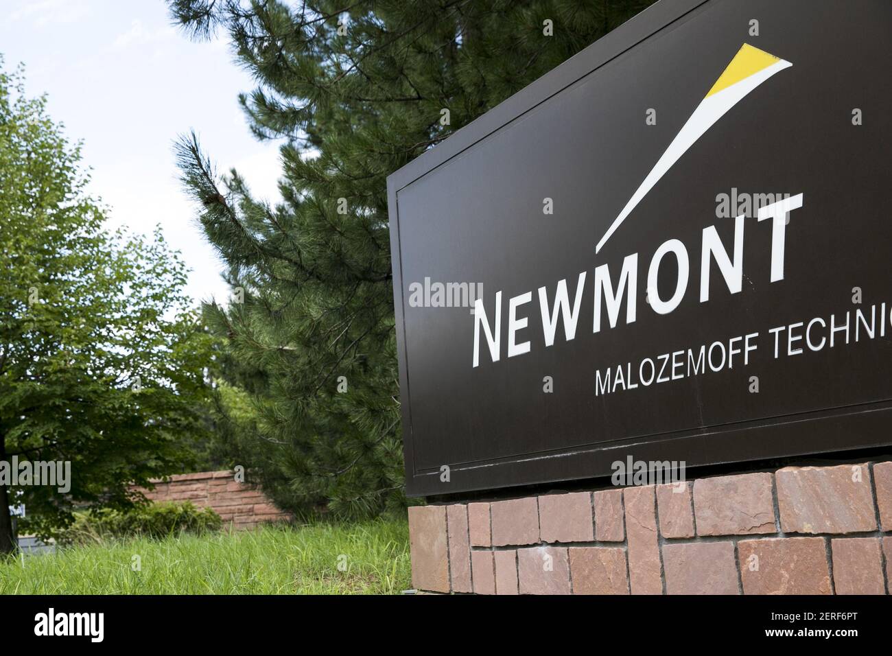 A logo sign outside of a facility occupied by the Newmont Mining ...