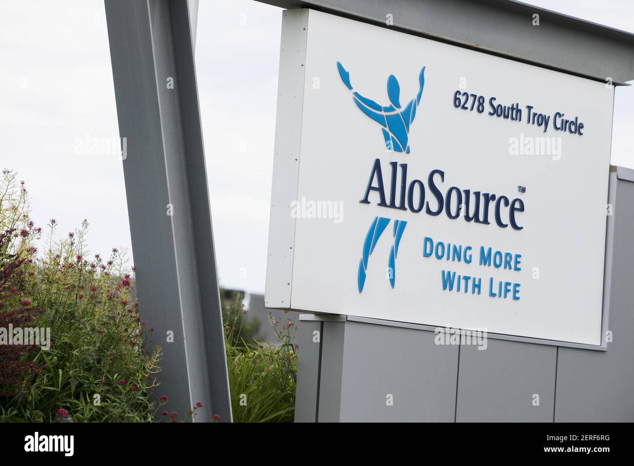 A logo sign outside of the headquarters of AlloSource in Centennial ...