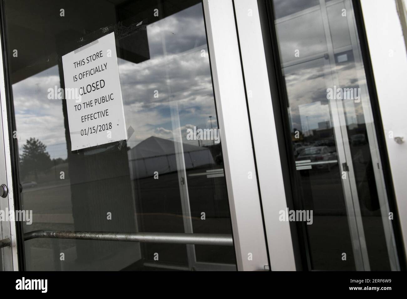 The a sign notifying customers that a Sears retail store location has ...