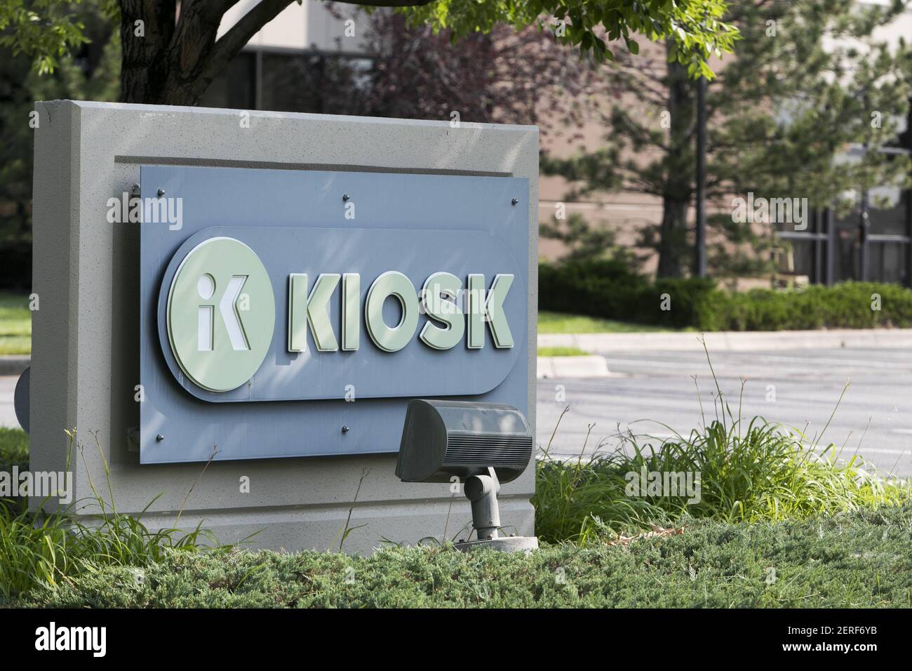 A logo sign outside of the headquarters of KIOSK Information Systems in ...