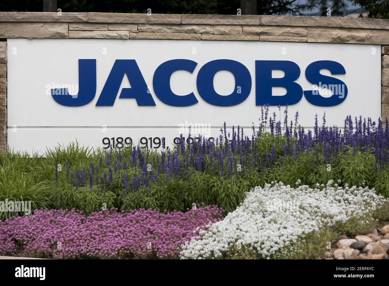 A logo sign outside of a facility occupied by the Jacobs Engineering ...