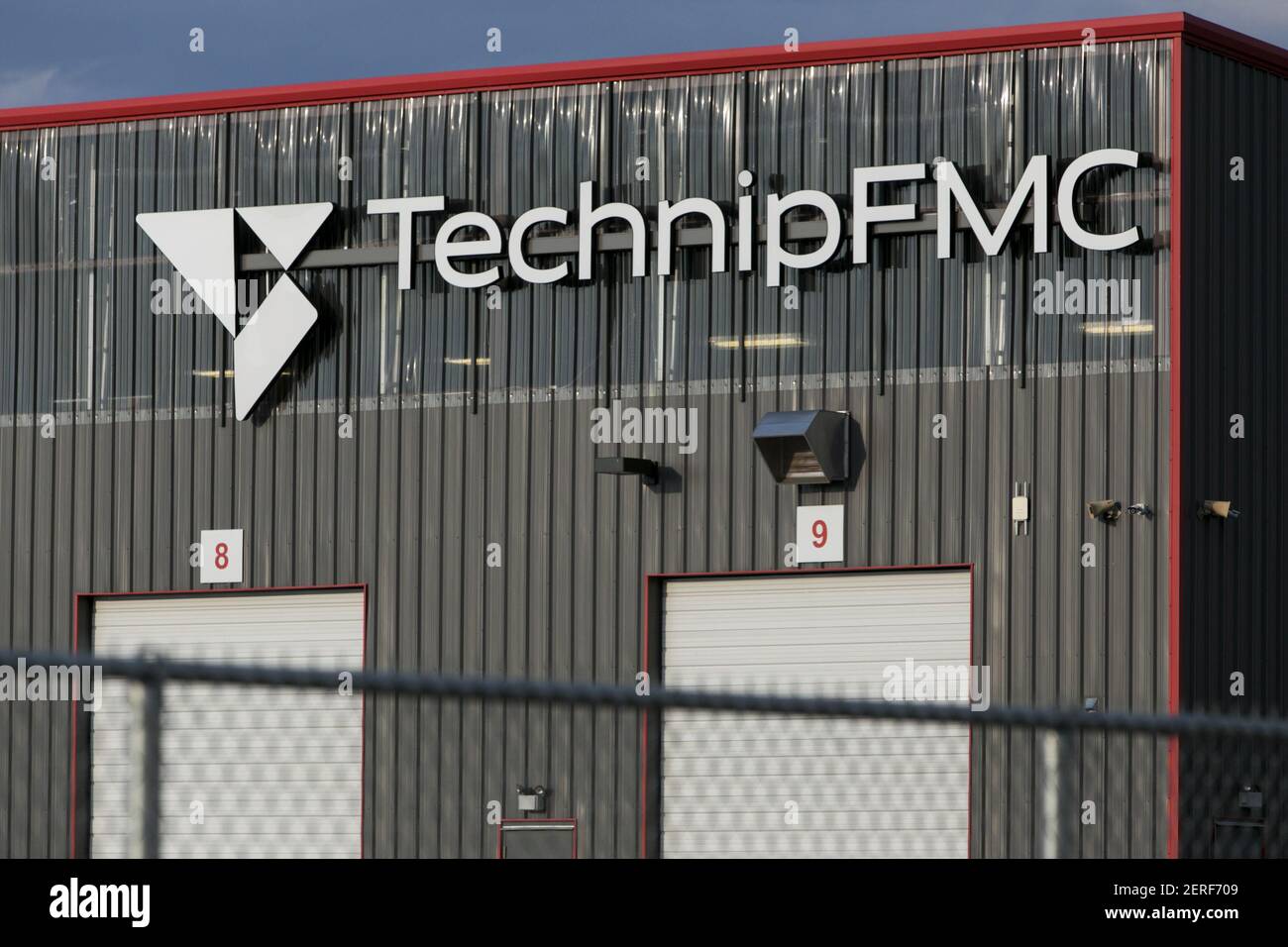 A logo sign outside of a facility occupied by TechnipFMC in Brighton ...