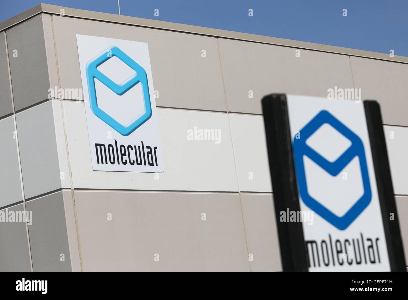 A logo sign outside of a facility occupied by Molecular Products Group ...