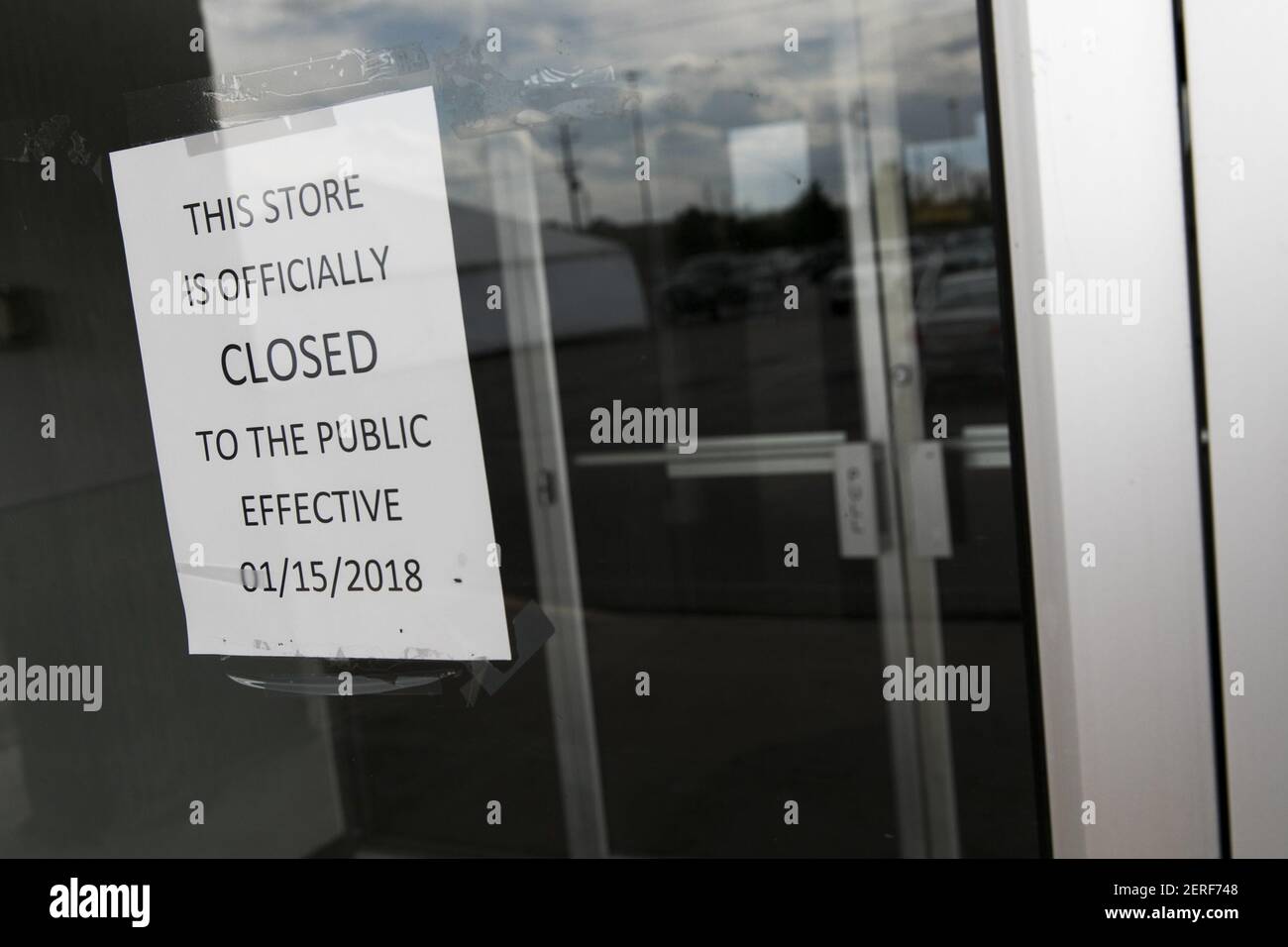 The a sign notifying customers that a Sears retail store location has ...