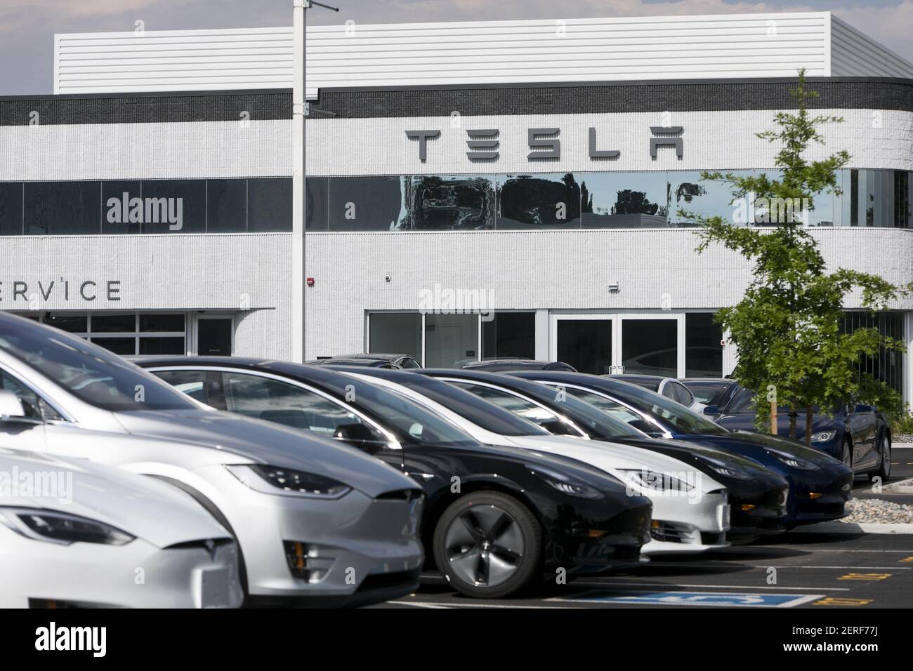 Tesla Model S, Model 3 and Model X electric vehicles at a Tesla Store ...