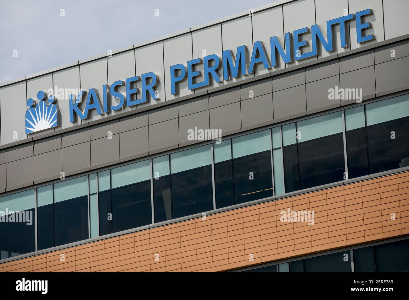 A logo sign outside of a facility occupied by Kaiser Permanente in Lone ...