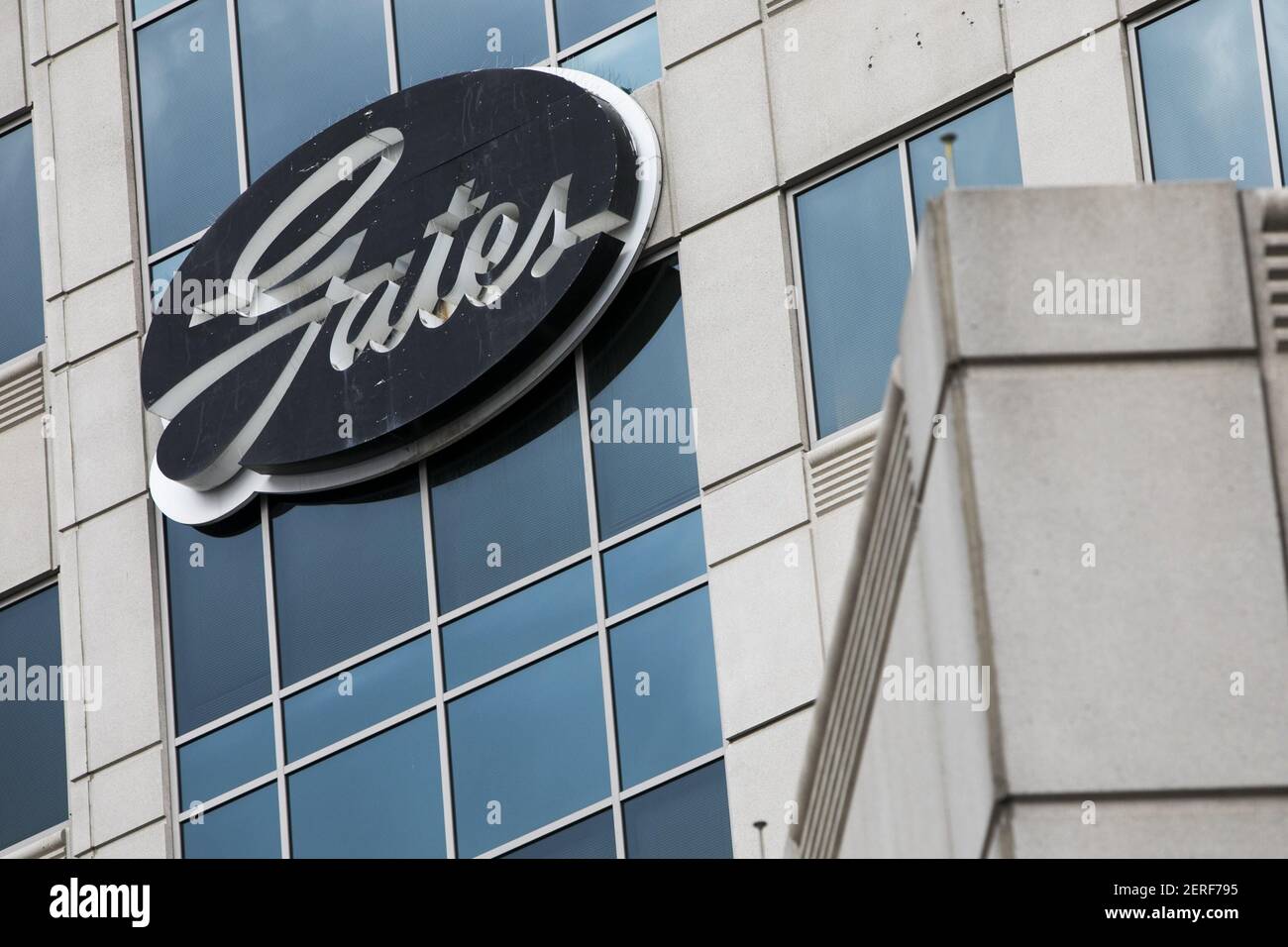 A logo sign outside of the headquarters of the Gates Corporation in ...