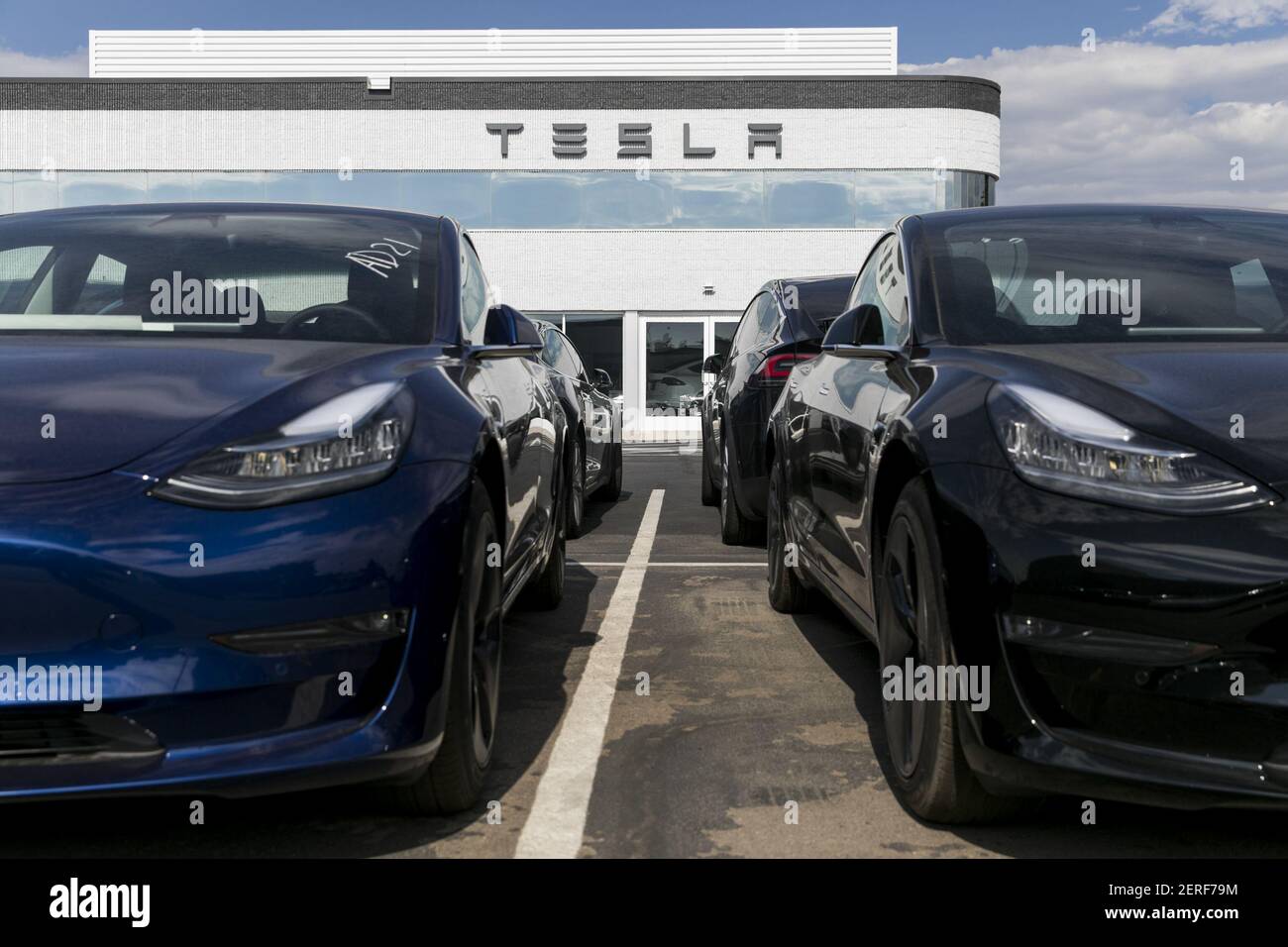 Tesla Model 3 electric vehicles at a Tesla Store location in Littleton ...