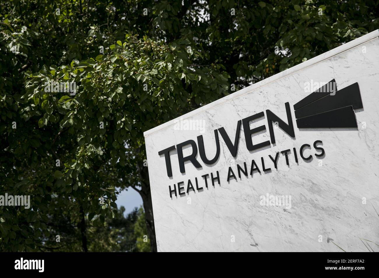 A logo sign outside of a facility occupied by Truven Health Analytics ...