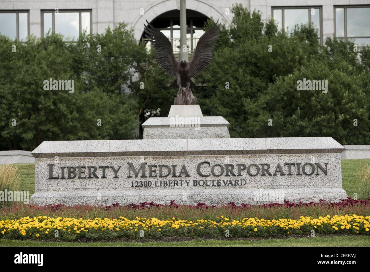 A logo sign outside of the headquarters of Liberty Media Corporation in ...
